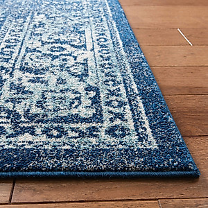 SAFAVIEH Evoke Collection Area Rug - 6'7" x 9', Navy & Ivory, Oriental Distressed Design, Non-Shedding & Easy Care, Ideal for High Traffic Areas in Living Room, Bedroom (EVK256A)