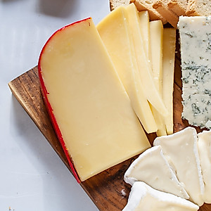 Dutch Gouda Cheese From Holland -And igourmet Cheese Storage Bag - Whole Wheel (10 pound) - Hits the midpoint of creaminess in the spectrum of cheeses