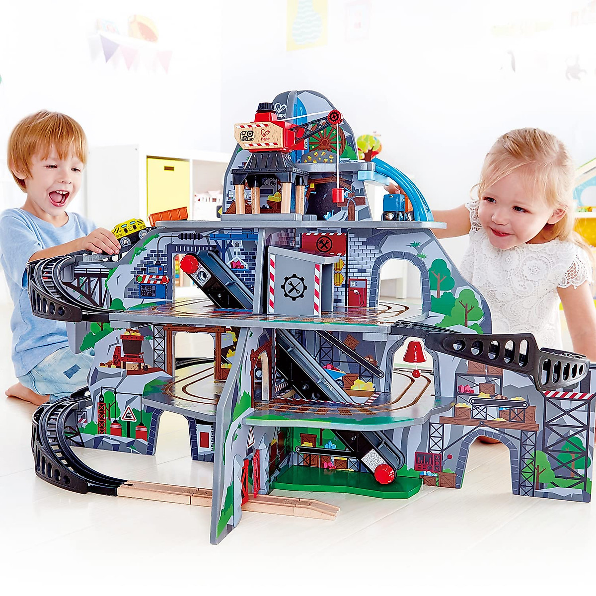 Hape Wooden Railway Mighty Mountain Mine Railway Playset| 4-Level Railway Train Track Playset with Crane and Magnetic Train Cars for Kids