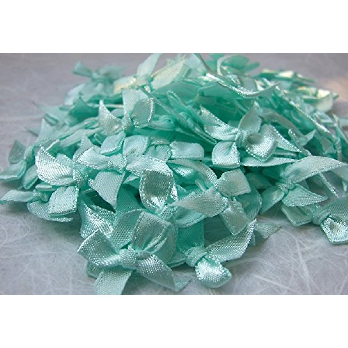 ICRAFY 100 Tiny Satin Ribbon Bows Blue Sea Color Mini Embellishment Craft Artificial Applique Wedding Ribbon Width 7 mm.