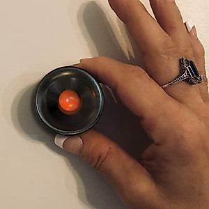 StudPoP Original Magnetic Stud Finder. Orange. Finds metal fasteners holding the wall to the studs. 1" diam moving magnet gives an audible click and a visual movement when fastener is found.