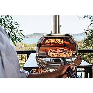 Offer - Save On Ooni Karu 16 Cover and Ooni 14" Perforated Peel with Ooni Karu 16 Mult-Fuel Pizza Oven – Cook in the Backyard and Beyond with this Outdoor Kitchen Pizza Making Oven Bundle