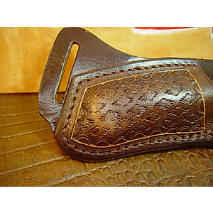 Custom left hand cross draw knife sheath for a buck 110 knife. The sheath is made out of buffalo hide leather hand tooled with a basket weave pattern.