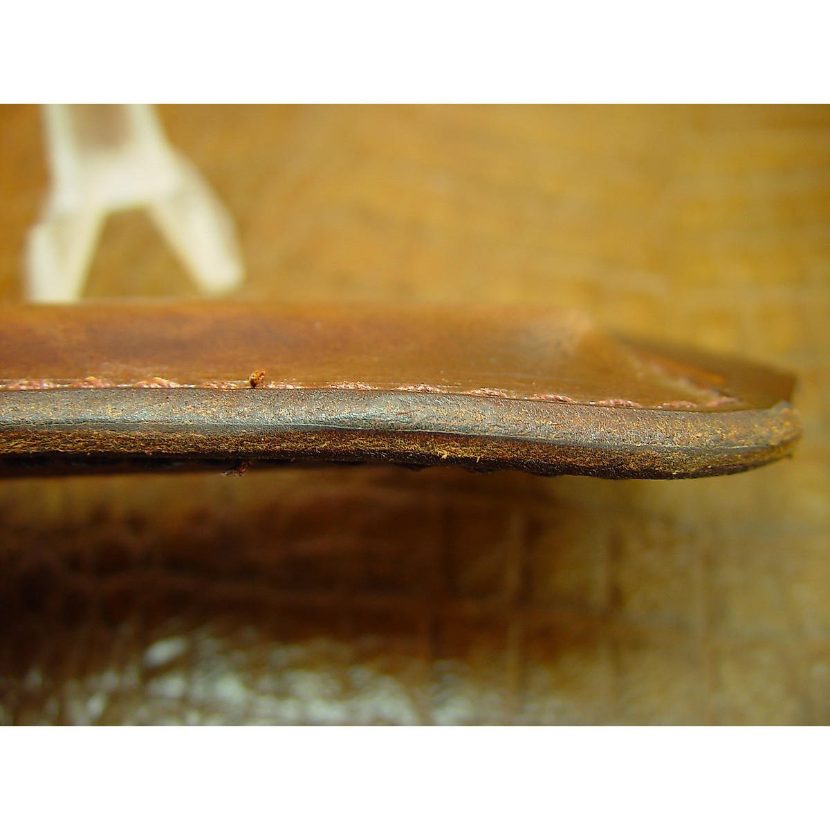 Custom Right-hand Cross Draw Trapper Style Folding Knife Sheath. Made Out of 10 Ounce Buffalo Hide Leather. Dyed Light Brown Sheath Only Knife Not Included.