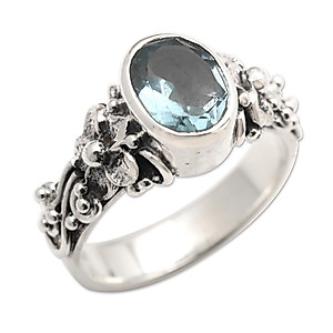 NOVICA Artisan Handmade Blue Topaz Single Stone Ring Oval Cut Silver with Floral Design Sterling Cocktail Indonesia Serenity Birthstone [crownbezel 0.4 in L x 0.3 in W x 0.3 in H Band Width 4 mm W]