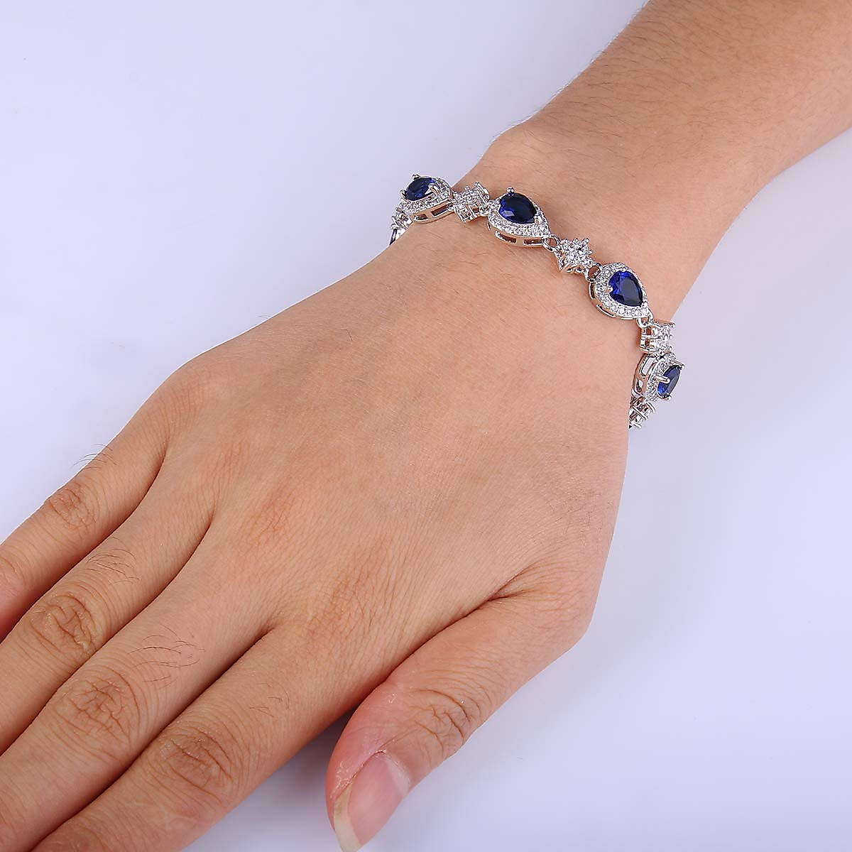 EleQueen Women's Silver-Tone Cubic Zirconia Teardrop Flower Bridal V-Necklace Sets Tennis Bracelet Dangle Earrings Sapphire Color