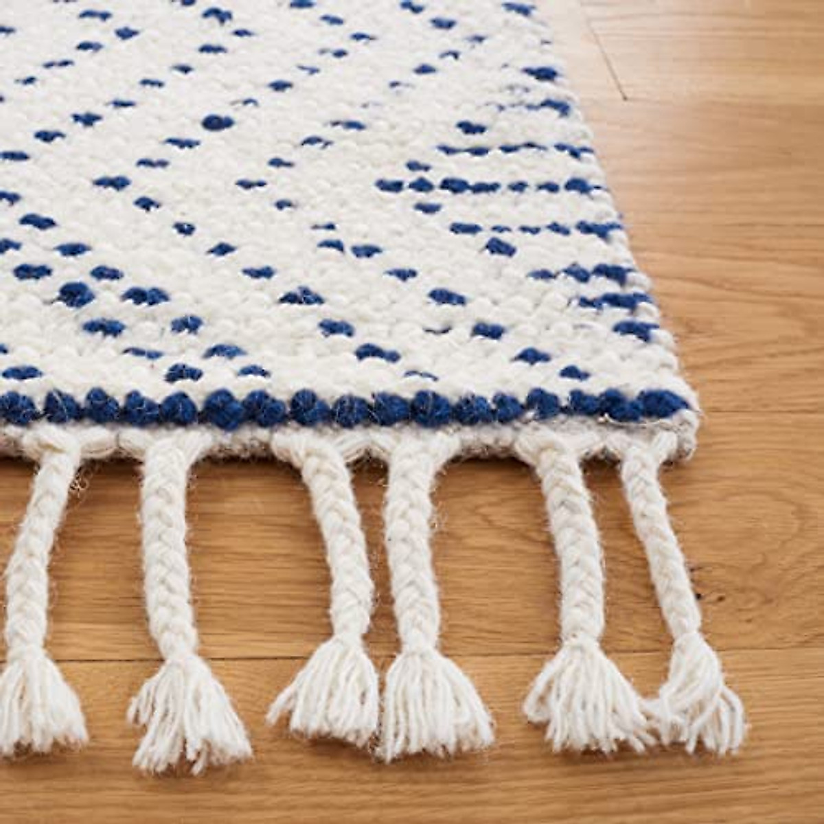 SAFAVIEH Natura Collection Accent Rug - 4' x 6', Ivory & Blue, Handmade Moroccan Boho Farmhouse Tribal Braided Tassel Wool, Ideal for High Traffic Areas in Entryway, Living Room, Bedroom (NAT184M)