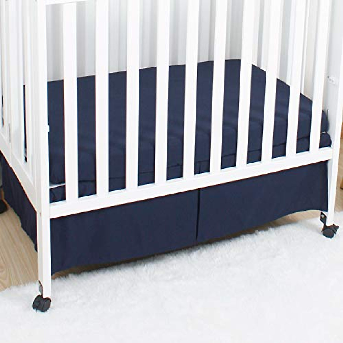 CaSaJa Mini Crib Skirt Pleated, Silk-Looking Soft Microfiber Baby Bed Skirt with Durable Platform for Mini and Portable Cribs 24" X 38", 12" Generous Drop Dust Ruffle, Machine Washable, Navy