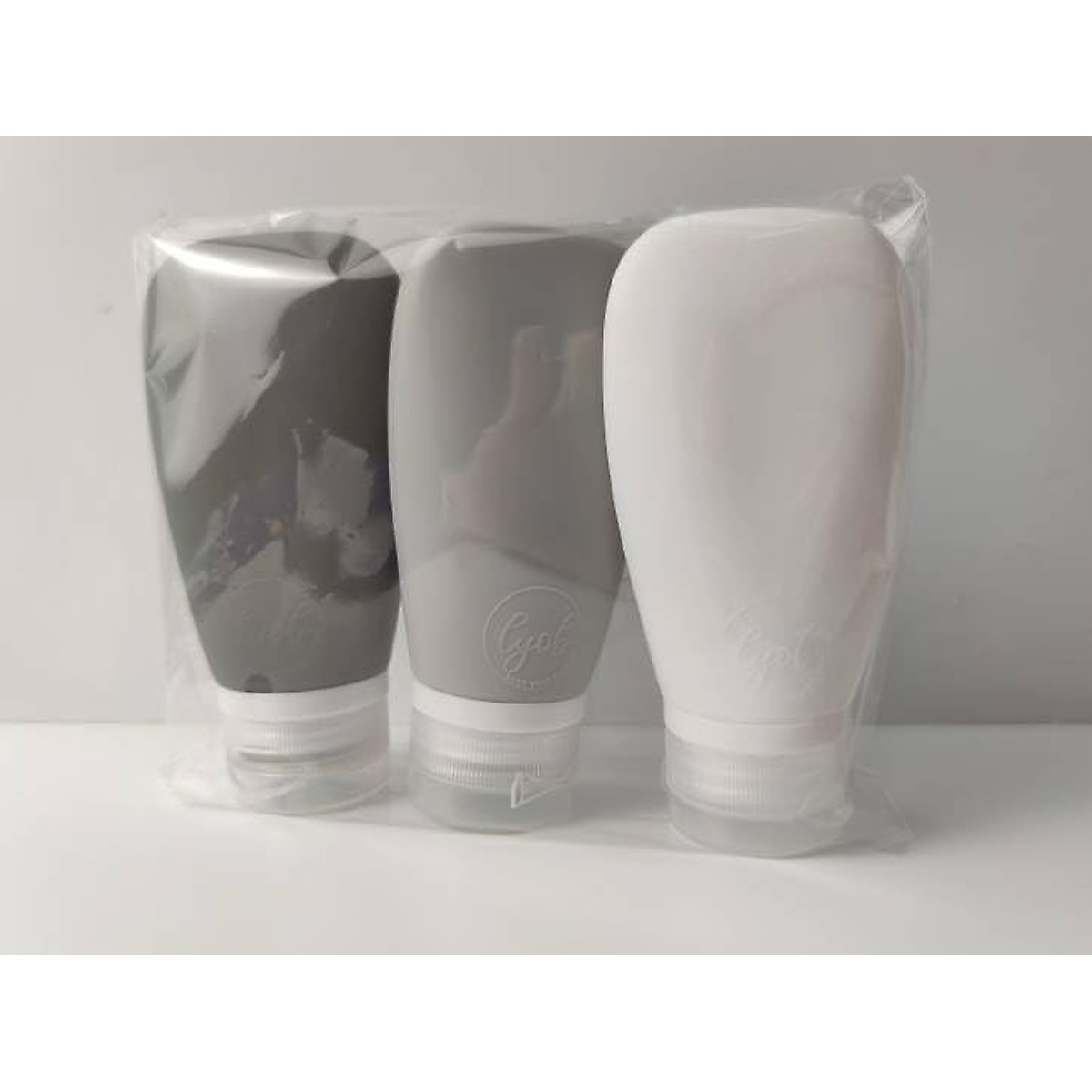 LYOB Travel Bottles for Toiletries, TSA Approved 3oz Leak Proof Silicone Refillable Squeeze Travel Size Containers BPA Free for Cleansers, Lotions, Shampoo 3-pk (Black-Gray-White)