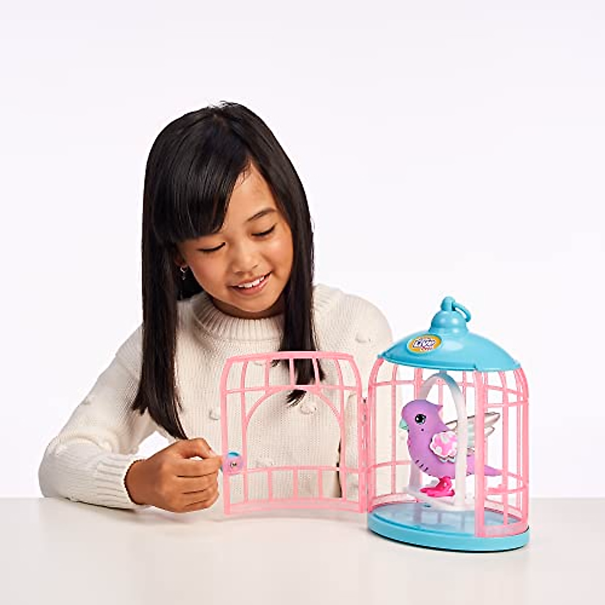 Little Live Pets - Lil' Bird & Bird Cage: Polly Pearl, New Light Up Wings with 20 + Sounds, and Reacts to Touch