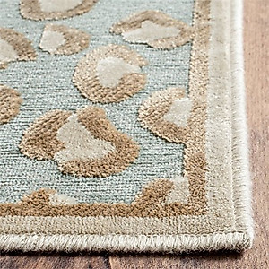 SAFAVIEH Paradise Collection Area Rug - 5'3" x 7'6", Stone & Aqua, Animal Print Viscose Design, Ideal for High Traffic Areas in Living Room, Bedroom (PAR84-3470)