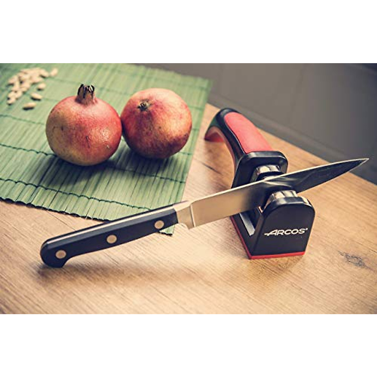 Arcos Sharpeners Manual Knife Sharpener tool. Made of ABS + TPE. Carbide and Ceramic Rollers. Keep Your Knives Razor Sharp. Black and Red Color