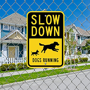 SmartSign 18 x 12 inch “Slow Down - Dogs Running” Metal Sign with Symbols, 63 mil Laminated Rustproof Aluminum, Black and Yellow, Made in USA