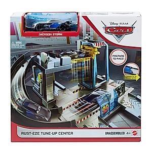 Disney Cars Toys Rust-Eze Tune-Up Center Toy Garage with Movie Themed Play Areas, Includes Jackson Storm Car, Transforming Feature, Elevator, Kids Birthday Race Gift Ages 4 and Older