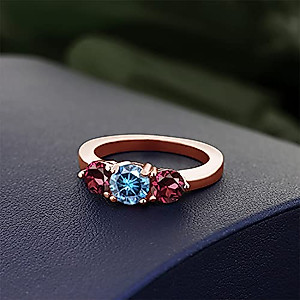 Gem Stone King 18K Rose Gold Plated Silver 3-Stone Ring Round Persian Blue Moissanite and Rhodolite Garnet Red (2.00 Cttw) (Size 9)