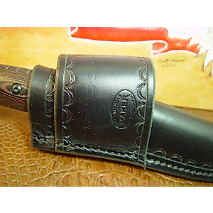 Custom cross draw knife sheath for the buck Selkirk knife. The sheath is made out of water buffalo hide leather Black.
