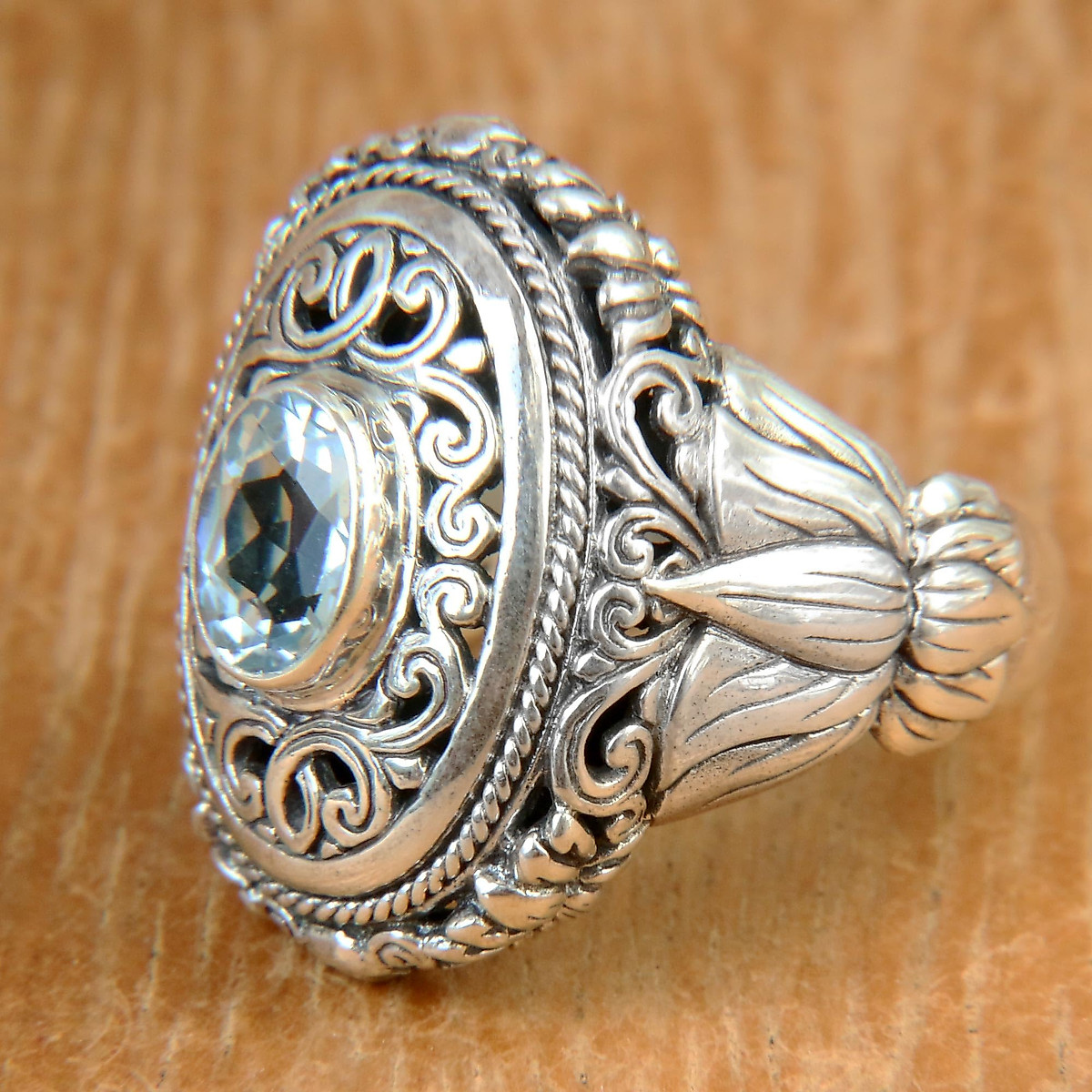 NOVICA Artisan Handmade Blue Topaz Cocktail Ring 1.5 Carat Sterling Silver Single Stone Indonesia Serenity Airy Birthstone [crownbezel 1 in L x 0.7 in W x 0.4 in D Band Width 4 mm W] ' Island Blue'