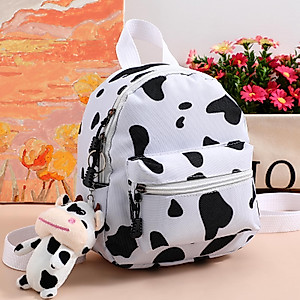TENDYCOCO Cow Backpack with Plush Cow Pendant Canvas Cow Print Backpack Cow Print stuff Cow Gifts for Women Mini Backpack for Women