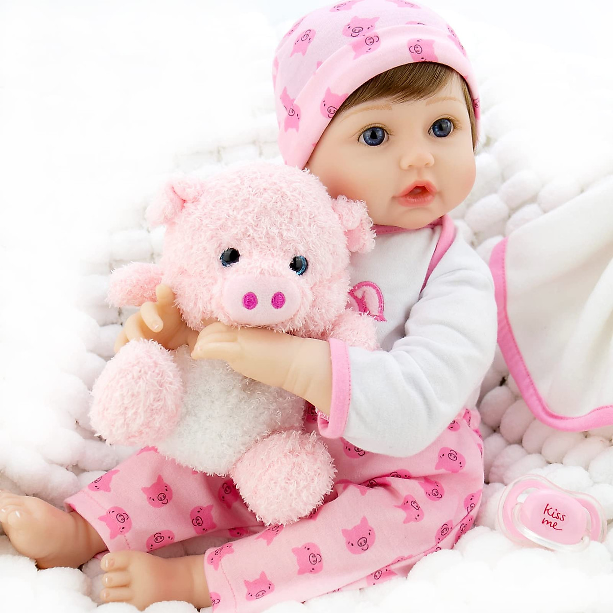 Aori Lifelike Reborn Baby Dolls 22 Inch Realistic Weighted Newborn Toddler Girl with Pink Clothes and Piggy Toy Accessories Best Birthday Set for Girls