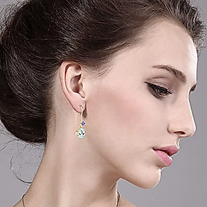 Gem Stone King 14K Yellow Gold Sky Blue Topaz and Blue Tanzanite French Wire Dangle Earrings For Women (1.26 Cttw, Gemstone November Birthstone, Oval 6X4MM and Round 2.5MM)