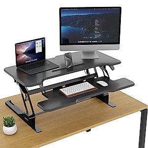 Mount-It! Height Adjustable Standing Desk Converter, 38” Wide, Stand Up Desk Riser for 2 Monitors, Manual Gas Spring Desktop Raises to 16.9", Fits Two Monitor Screens with Keyboard Mouse Tray in Black