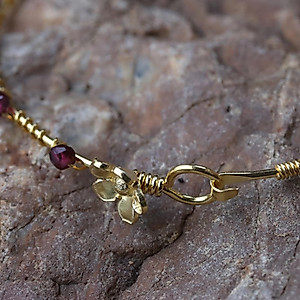 NOVICA Artisan Gold Plated Garnet Bangle Bracelet Floral from Thailand Red Tone Birthstone [7.5 in Inner Circ. 4 mm W] ' Floral Berries'