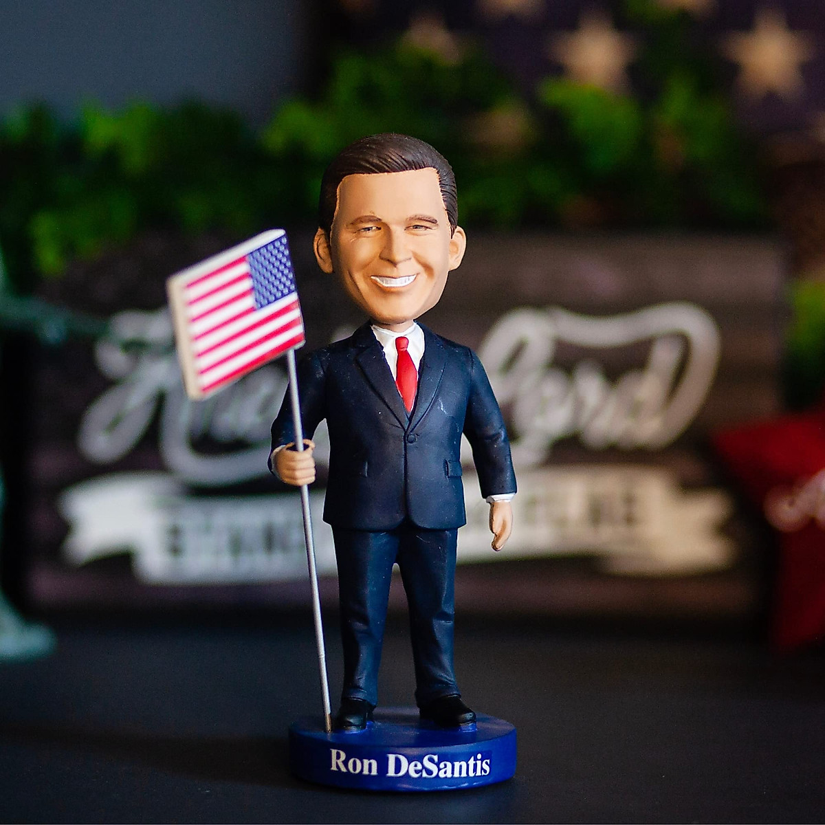 Governor Ron Desantis Bobblehead Collectible | 7” Tall Resin Figurine of Desantis Holding an American Flag | Governor Desantis Bobble