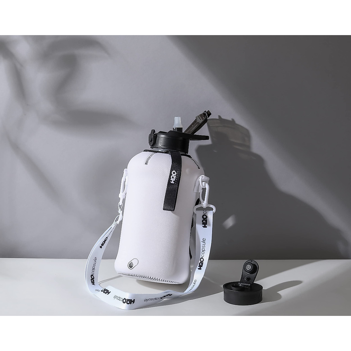 H2O Capsule 2.2L Half Gallon Water Bottle with Storage Sleeve and Covered Straw Lid – BPA Free Large Reusable Drink Container with Handle - Big Sports Jug, 2.2 Liter (74 Ounce) Canvas White