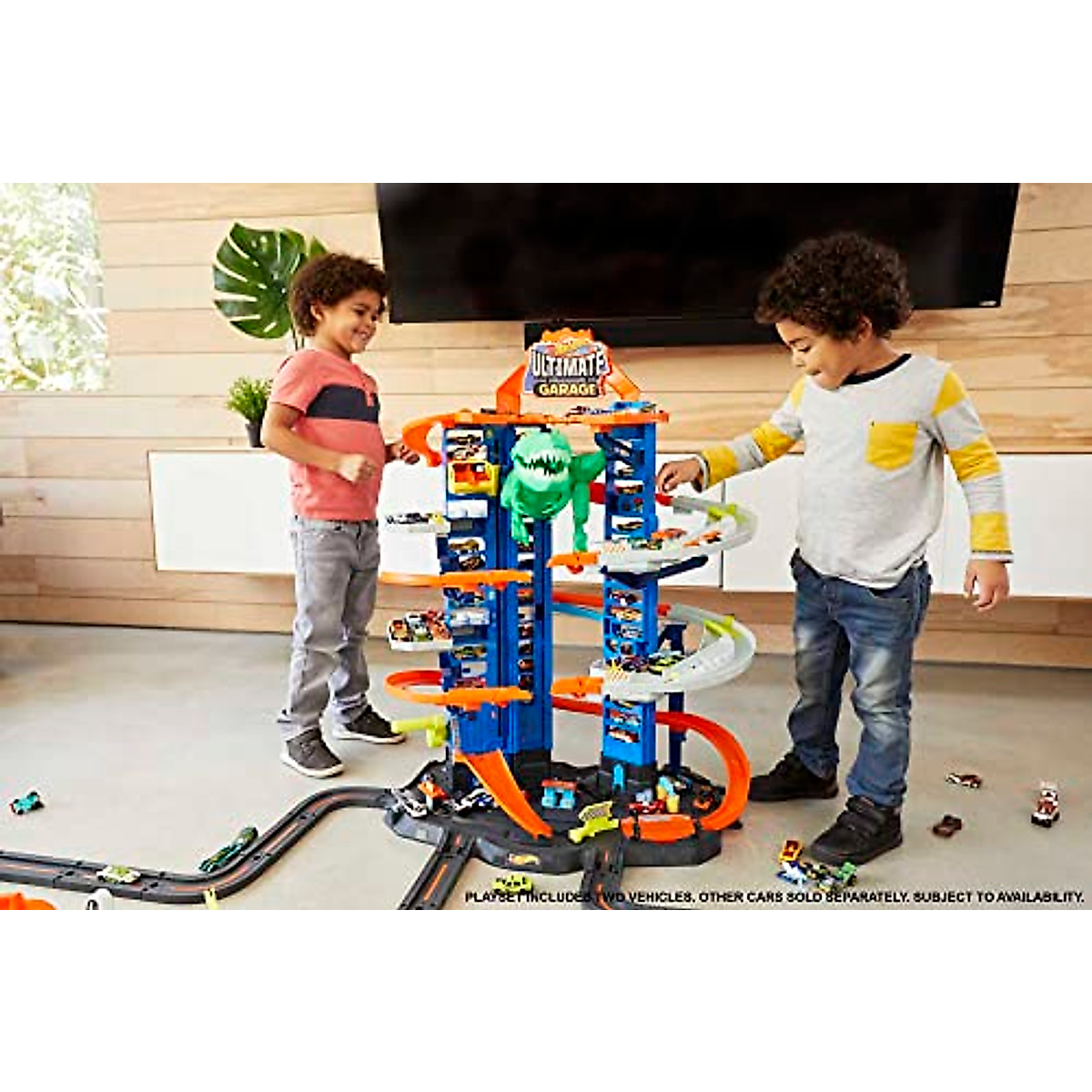 Hot Wheels Toy Car Track Set City Ultimate Garage Moving T-Rex Dinosaur, 100+ 1:64 Scale Vehicle Storage, 3-Ft Tall, 2 Toy Cars