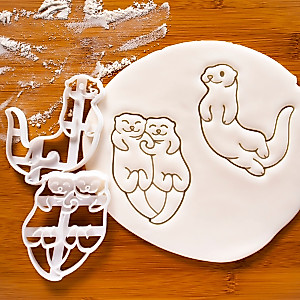 Set of 2 Otter cookie cutters (Design: Swimming Sea Otter and Otter Holding Hands), 2 pieces - Bakerlogy