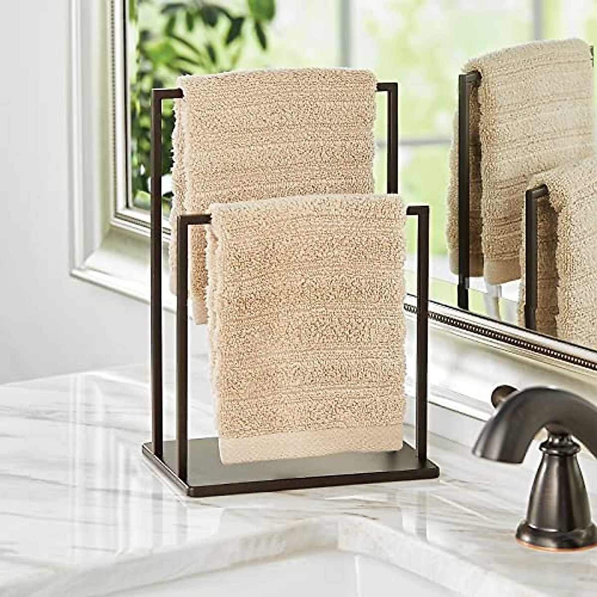 mDesign Modern Decorative Metal Fingertip Towel Holder Stand for Bathroom Vanity Countertops to Display and Store Small Guest Towels or Washcloths - 2-Sided - Bronze