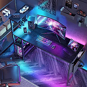 Bestier Gaming Desk with LED Lights, Computer Desk with 4 Tiers Reversible Shelves, 51.3 Inch Home Office Writing Desk with Side Storage Bag, Hooks and Height Adjustable Shelf (Black Grained)