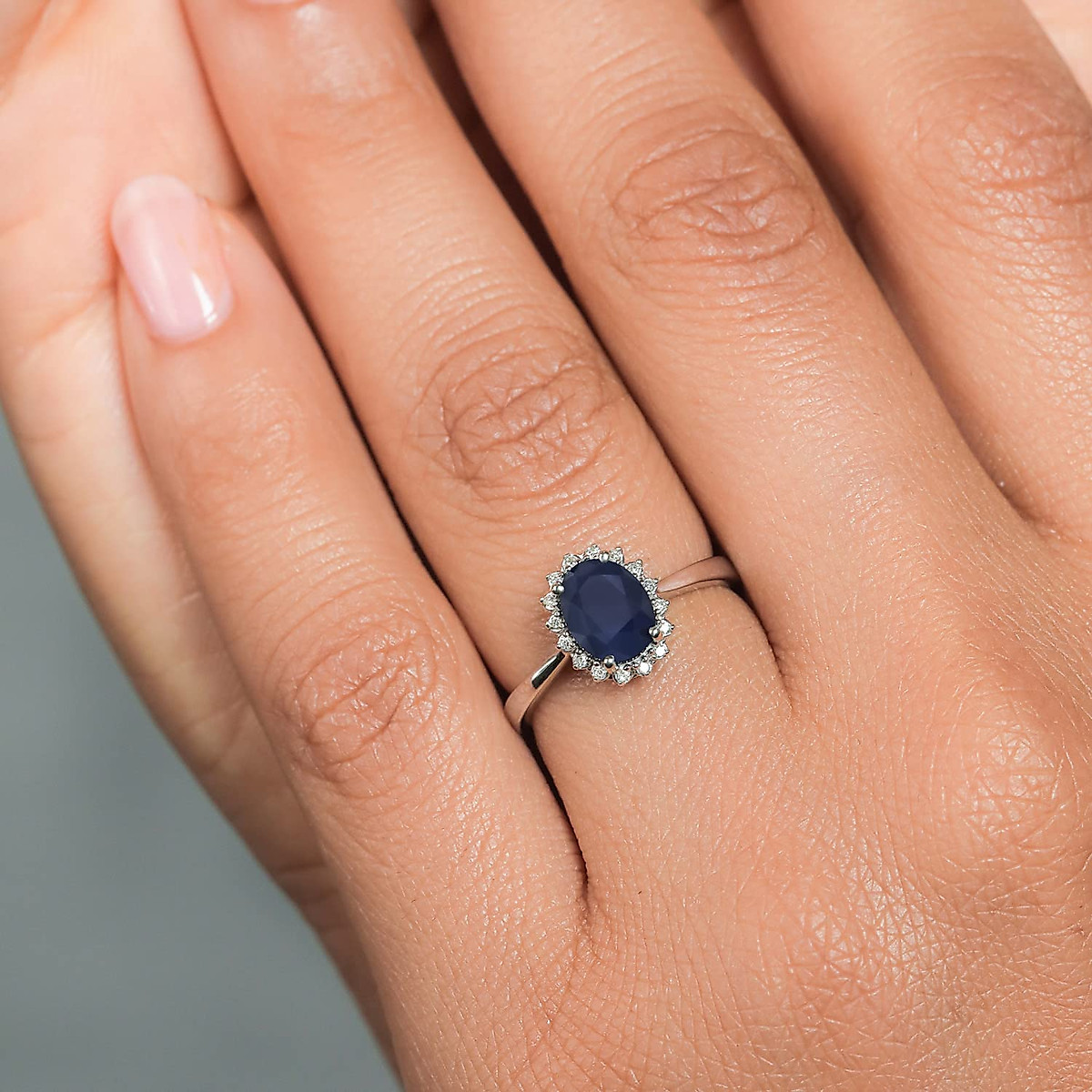 Gem Stone King 10K White Gold Blue Sapphire and Diamond Halo Engagement Ring For Women (1.85 Cttw, Oval 8X6MM, Size 7)