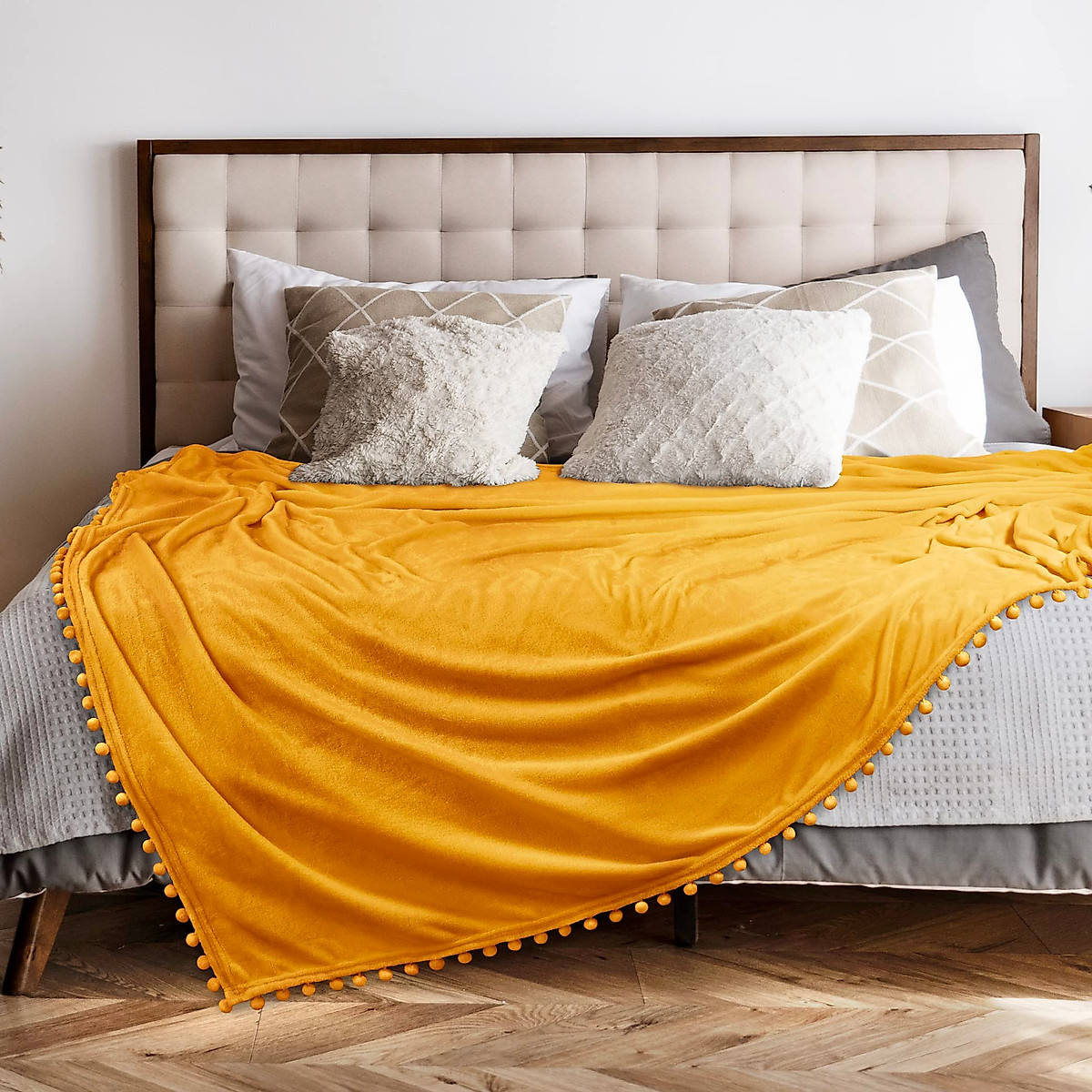 PAVILIA Mustard Yellow Throw Blanket Pom Pom for Couch, Twin Size, Soft Fleece Cozy Pompom Fringe Sofa Blanket, Decorative Home Gift Flannel Velvet, Gold Yellow, 50x60