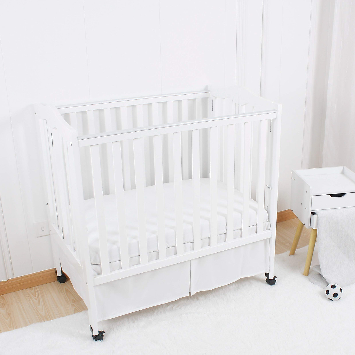 CaSaJa Mini Crib Skirt Pleated, Silk-Looking Soft Microfiber Baby Bed Skirt with Durable Platform for Mini and Portable Cribs 24" X 38", 12" Generous Drop Dust Ruffle, Machine Washable, White Color