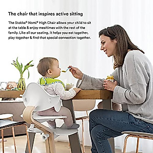 Stokke Nomi High Chair, Grey/Natural - Inspires Active Sitting - Tool-Free, Seamless Adjustability - Includes Baby Set with Removable Harness for Children 6-24 Months