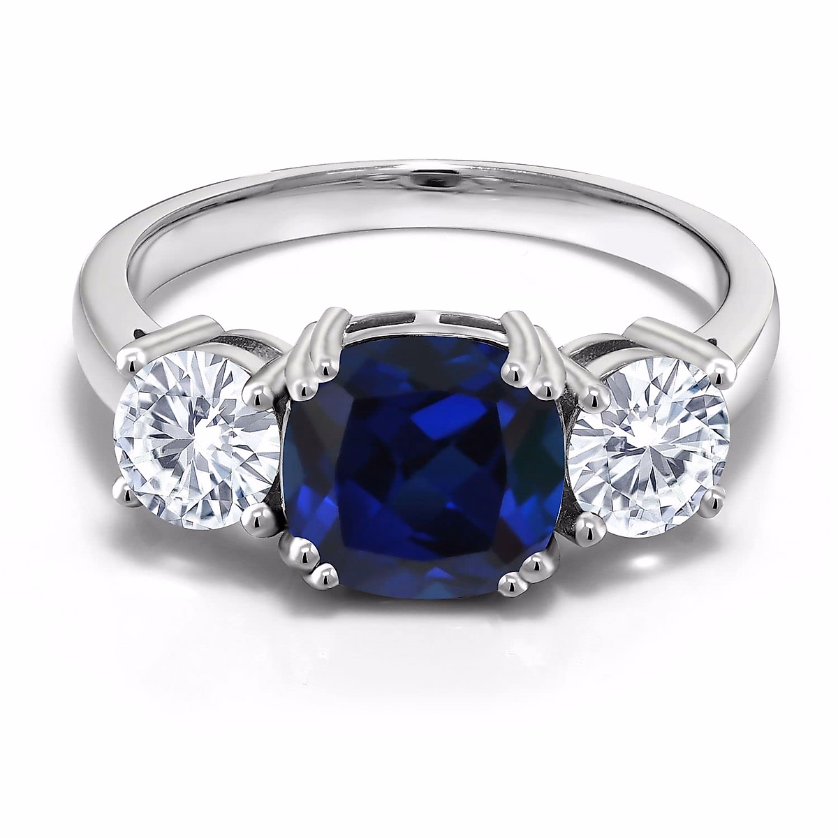 925 Sterling Silver Blue Created Sapphire and Forever Classic Moissanite From Charles & Colvard 3 Stone Engagement Ring For Women (3.50 Cttw, Gemstone September Birthstone, Cushion 8MM, Size 5)