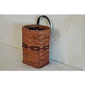 Hand Woven Utensil Wall Hanging Basket. This Cute Basket Is Handmade Locally Here in Ohio By the Local Amish. It Is a Very Handy Basket That Allows You to Store Your Utensils in a Basket on the Wall Saving Space on Your Counters. Measures: 4" X 3" X 8" Ta