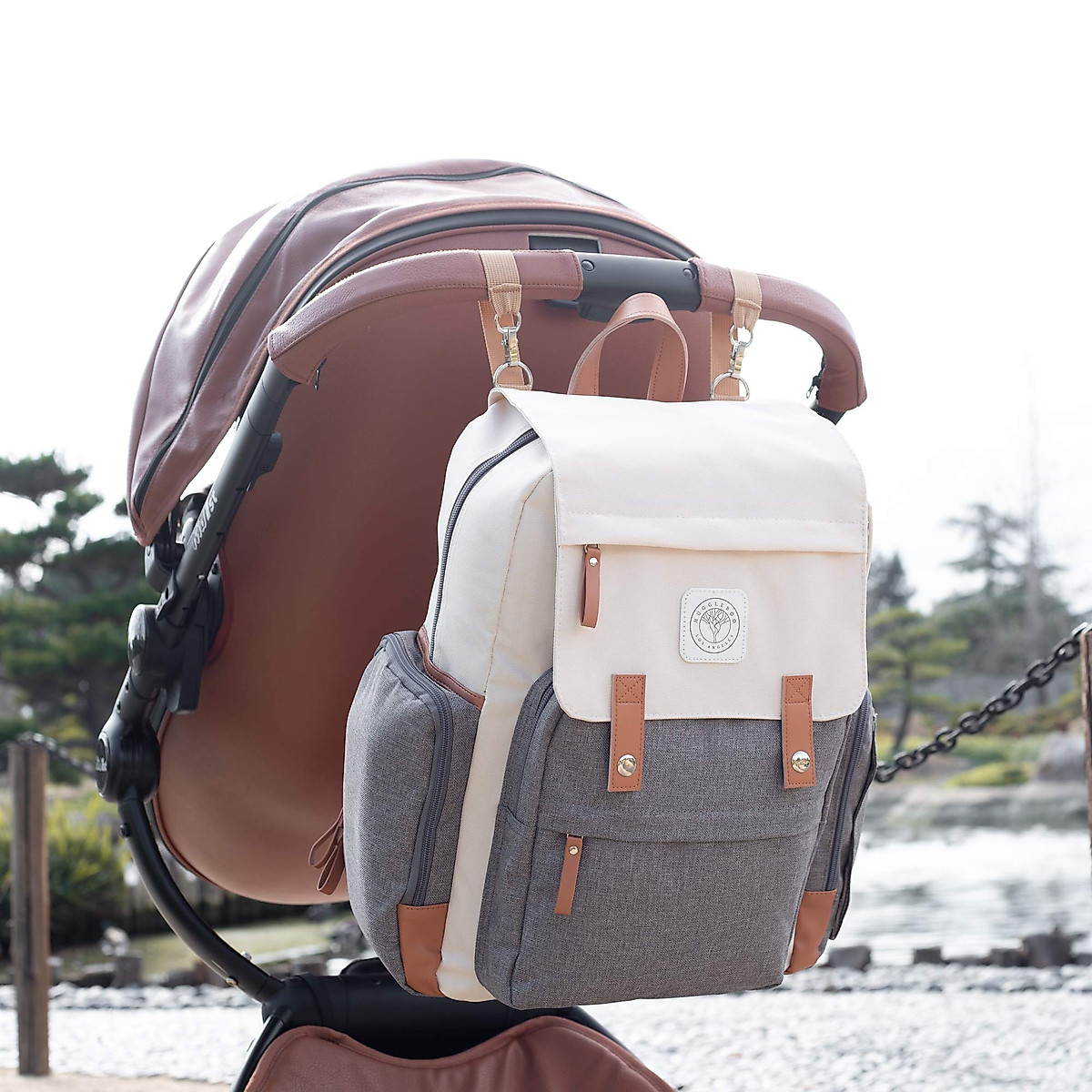 Huggleboo Diaper Backpack - Waterproof Canvas Baby Bag with Wipes Pocket Stroller Straps Changing Pad and Laptop Pocket - Unisex Maternity Travel Nappy Bag for Moms Dads Boys and Girls - Beige/Grey