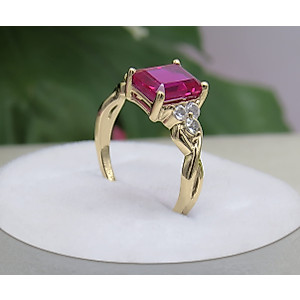 Dazzlingrock Collection 8x6mm Emerald Shape Center Lab Created Ruby & 2.2mm Round White Sapphire on Side Crisscross Shank Engagement Ring for Her in 10K Yellow Gold Size 7