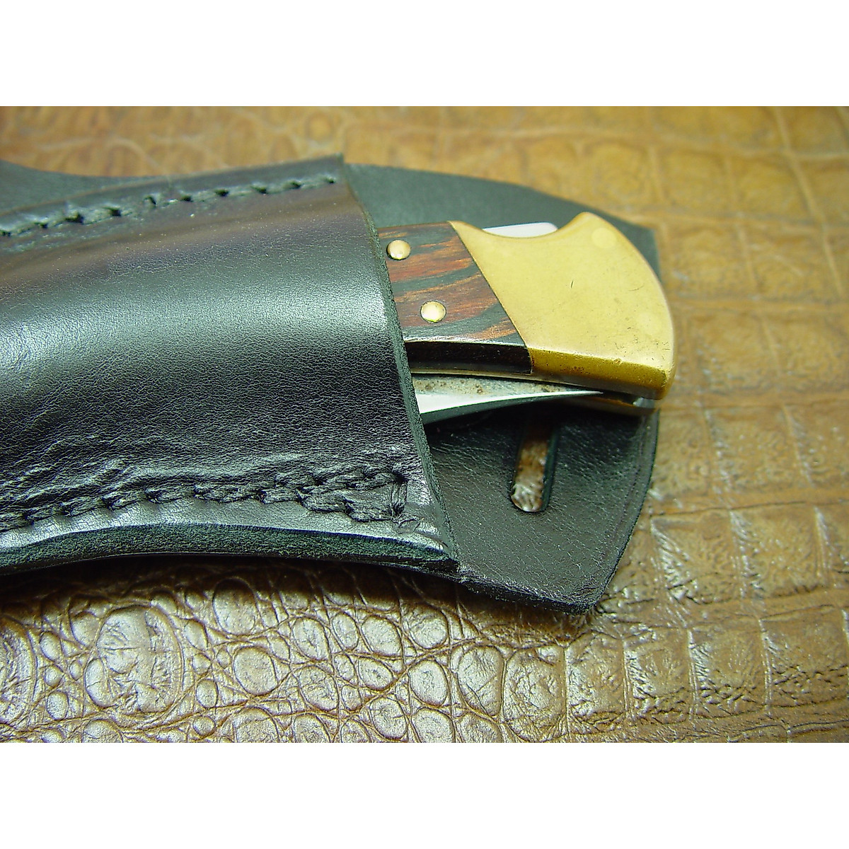 Custom Left Hand Cross Draw Knife Sheath for a Buck 110 Knife. The Sheath is Made Out of Buffalo Hide Leather Dyed Black.