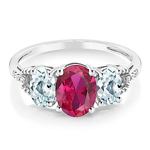 Gem Stone King 10K White Gold Oval Red Created Ruby Sky Blue Aquamarine and Diamond Accent 3 Stone Women Engagement Ring (2.06 Cttw) (Size 8)