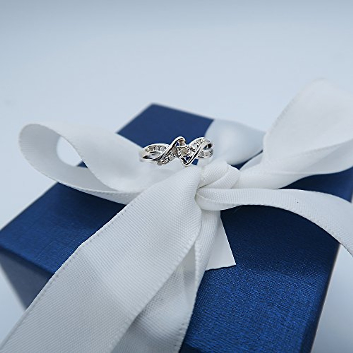 Dazzlingrock Collection 0.15 ctw Round White Diamond Swirl Bypass Split Shank Ring for Women in 925 Sterling Silver Size 7