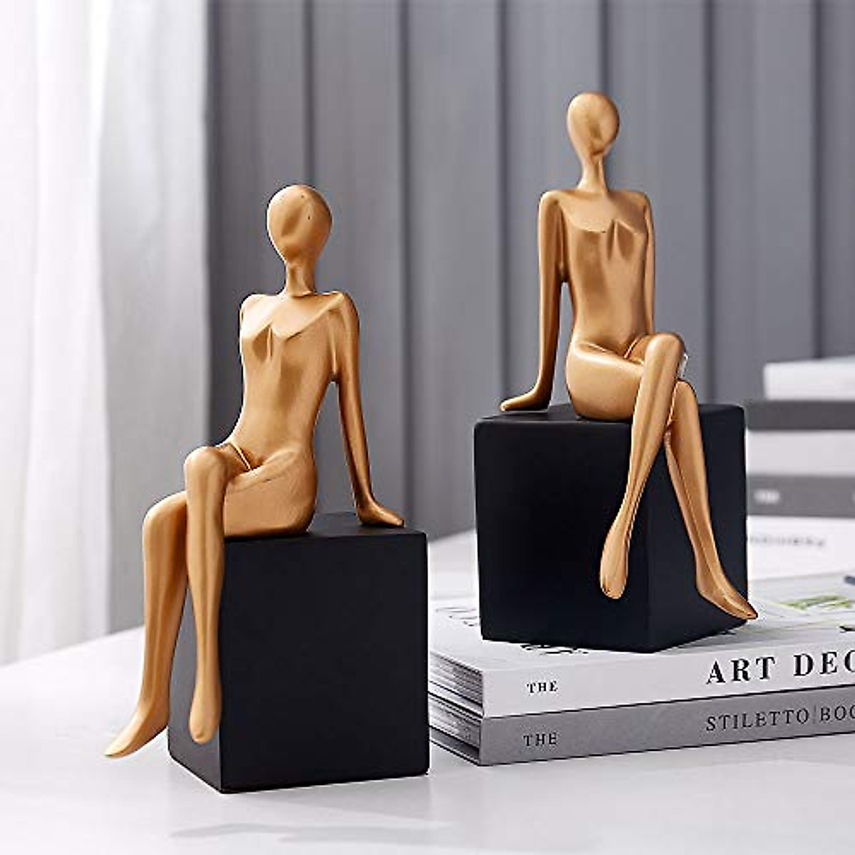 Modern Girl Statues Decorative Bookend Set. Add Modern Touch to Any Shelf or Table with These Unique Art of Confident Girl Statues. Use Them as Bookends Or Décor to Your Home and Office Modern Vibe!