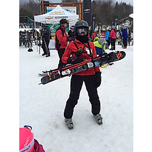 Carrier strap for single or multiple pairs of skis, poles, boots or snowboards