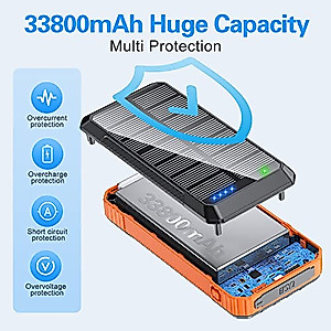 DJKK Solar Power Bank Wireless Charger 33800mAh Built in 4 Cables and LED Camping Lights 22.5W Fast Charging Power Bank 7 Outputs 4 Inputs Portable Charger Compatible with All Mobile Devices (Orange)