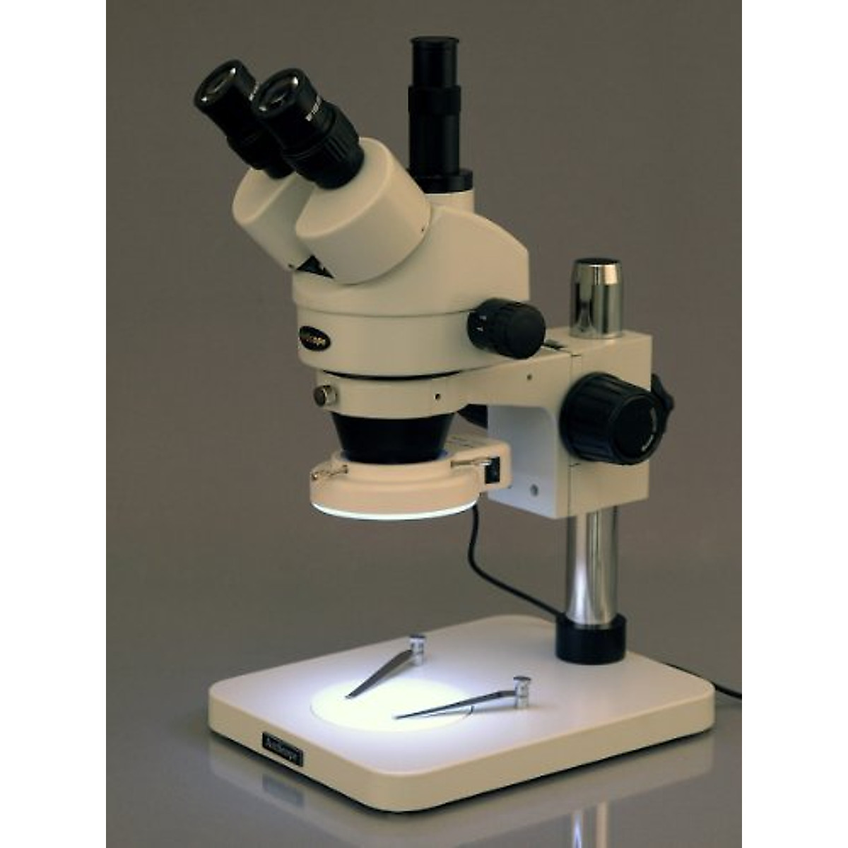 AmScope SM-1TSZZ-144S-10M Digital Professional Trinocular Stereo Zoom Microscope, WH10x and WH20x Eyepieces, 3.5X-180X Magnification, 0.7X-4.5X Zoom Objective, 144-Bulb LED Ring Light, Pillar Stand, 110V-240V, Includes 0.5X and 2.0X Barlow Lenses and 10MP