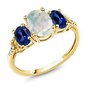 Gem Stone King 10K Yellow Gold White Simulated Opal and Blue Created Sapphire Engagement Ring For Women (2.24 Cttw, Oval Cabochon Cut) (Size 8)