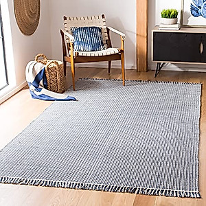 SAFAVIEH Montauk Collection Area Rug - 6' x 9', Ivory & Black, Handmade Flat Weave Boho Farmhouse Cotton Tassel Fringe, Ideal for High Traffic Areas in Living Room, Bedroom (MTK340D)