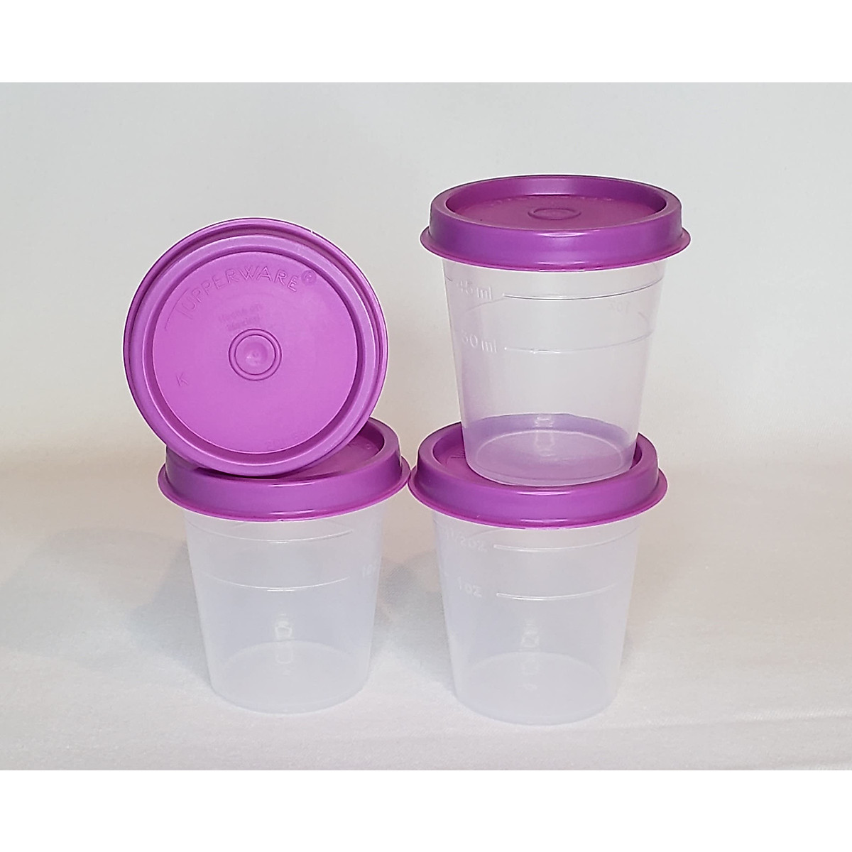 Tupperware Set of 4 Midgets with Purple Colored Seals (2 Oz Size)